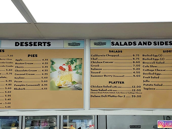 A menu board that reads like a love letter to carbs. Pies, salads, and sandwiches, oh my! Decisions, decisions.