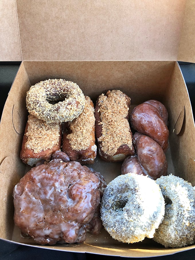 A box of happiness, served fresh daily. These assorted donuts are like edible works of art, each one a masterpiece of flavor.