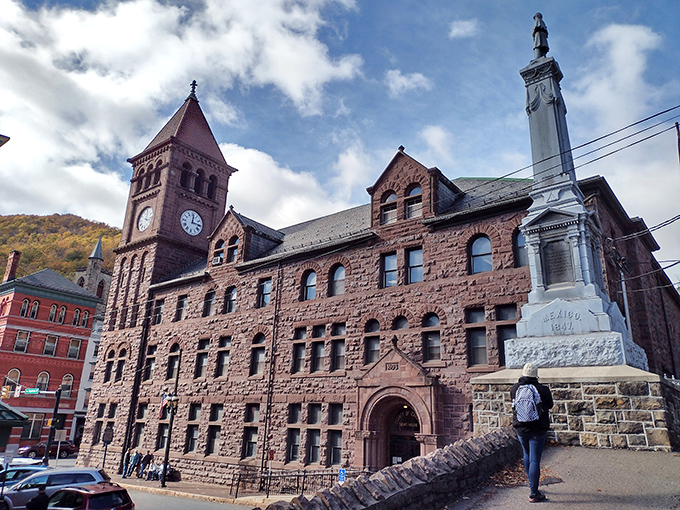 The Carbon County Courthouse stands like a Victorian sentinel, its clock tower keeping watch over a town where history isn't just remembered&mdash;it's lived daily.