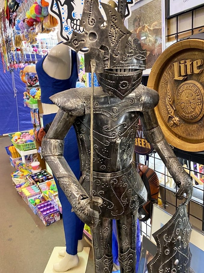 Sir Bargain-a-lot stands guard! This metal knight statue proves that even chivalry gets a second chance at flea markets.