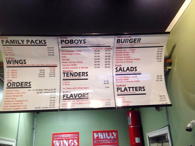 A menu board that gets straight to the point: wings, po'boys, and platters without the flowery descriptions. Food that speaks for itself.