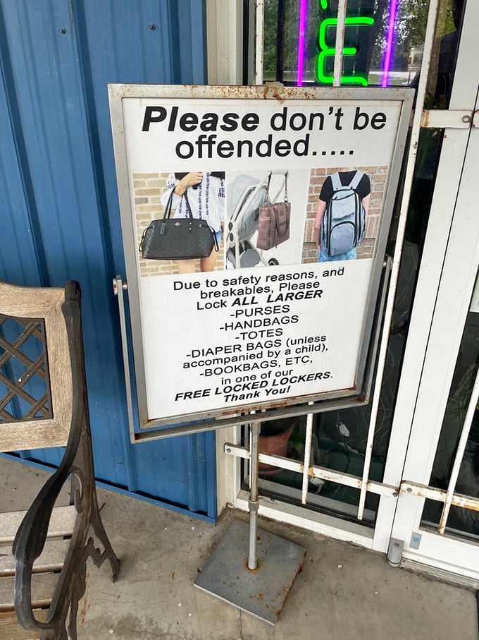 "Please don't be offended..." begins the most polite heist prevention sign ever. It's not you, it's your oversized purse they're worried about!