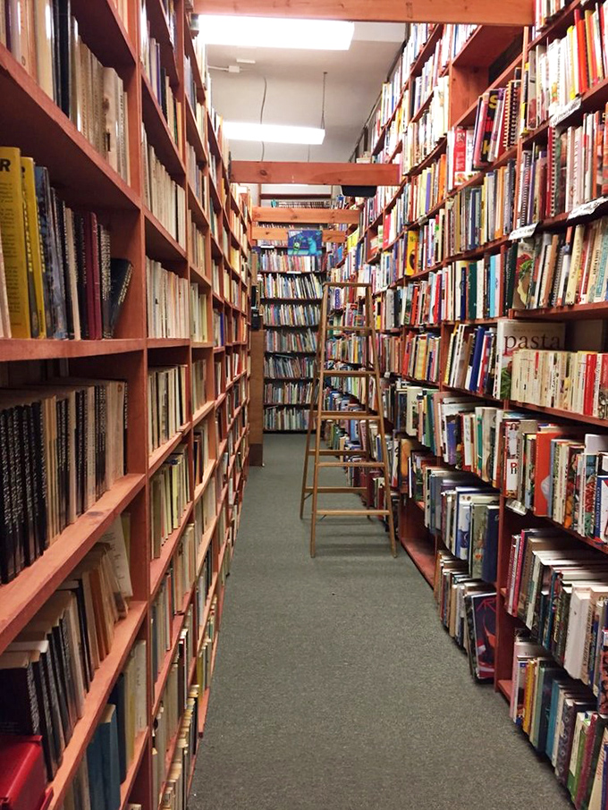 Narrow passages to enlightenment! These aisles aren't just walkways; they're portals to countless worlds, each book a doorway to imagination.