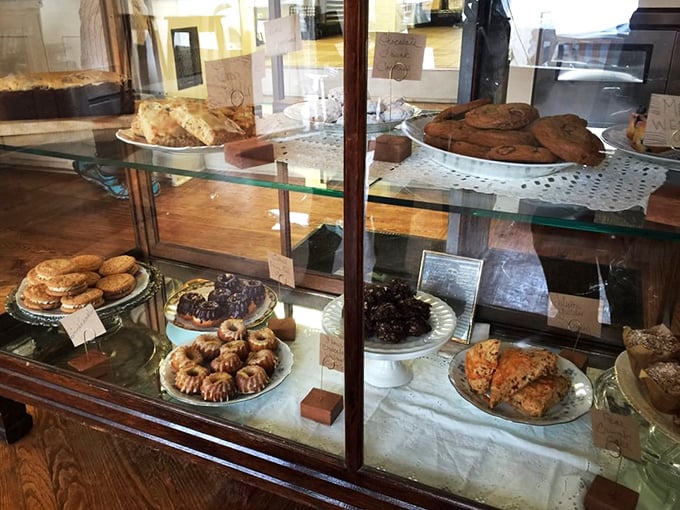 Behold, the glass case of temptation! It's a carb lover's dream and a dieter's kryptonite. Resistance is futile, my friends – just embrace the delicious inevitability.