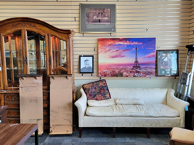 Mid-century modern meets Parisian dreams in this furniture vignette. That cream sofa has stories to tell&mdash;and at thrift store prices, you can afford to listen.