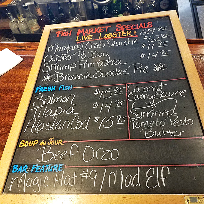 Ahoy, menu mateys! This chalkboard of delights is your treasure map to seafood nirvana. X marks the spot for "Brownie Sundae Pie"!