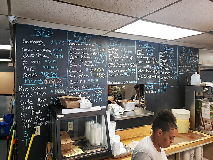 Behold, the chalkboard of dreams! This menu is like a love letter to carnivores, written in the universal language of barbecue.