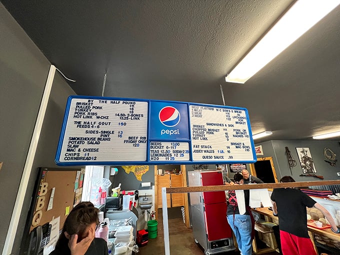 Behold, the sacred text of smoked meats! This menu board is like the Rosetta Stone of barbecue, promising delights that'll make your taste buds sing.