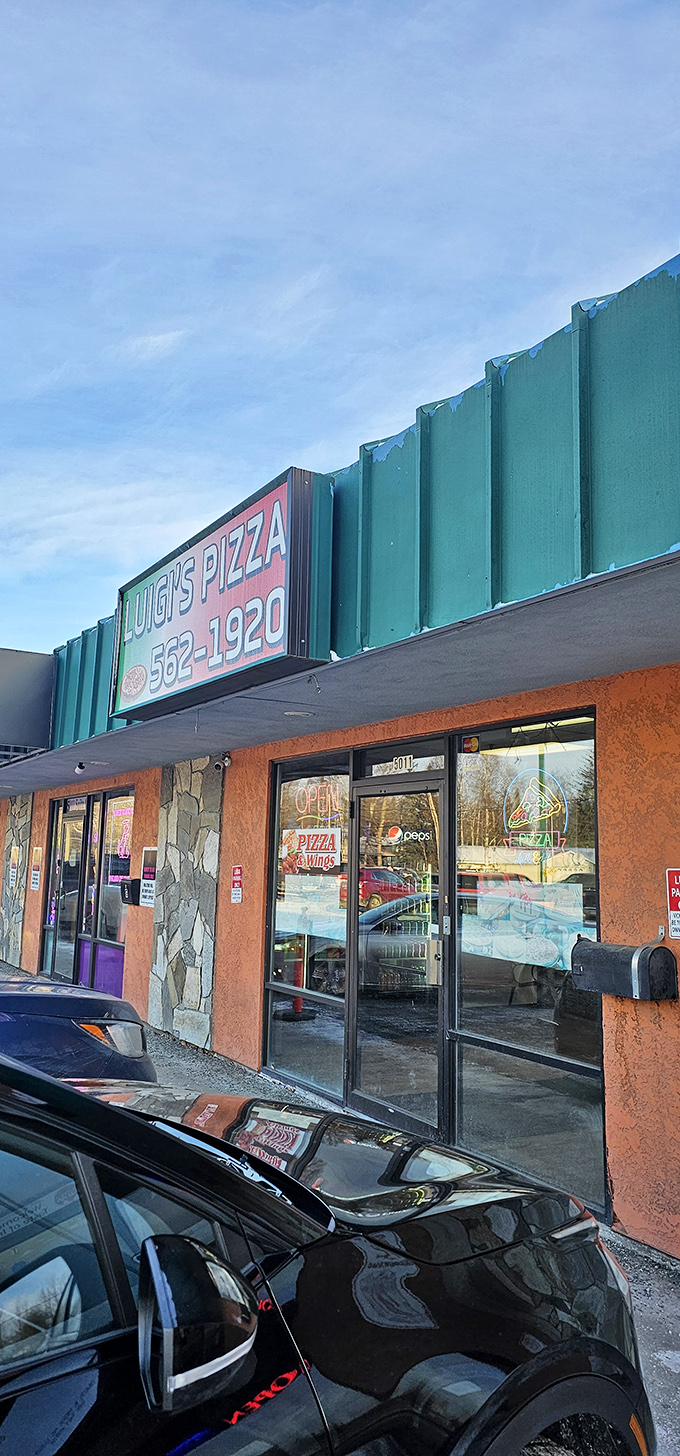 Luigi's Pizza: Don't judge a book by its cover! This unassuming storefront hides a cheesy paradise that would make even Mario jealous.