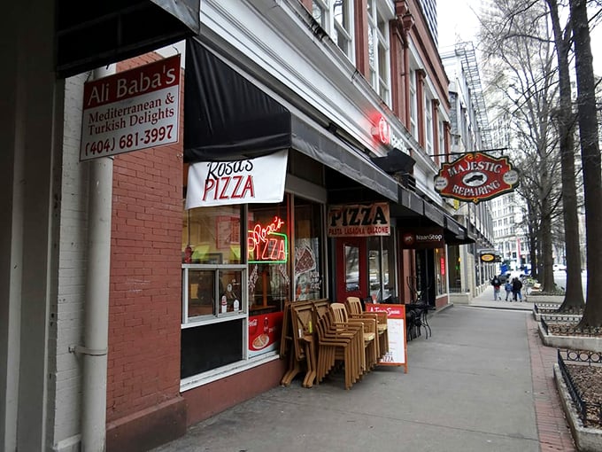 Rosa's neon sign: the bat signal for pizza lovers. This Atlanta gem promises a slice of New York nostalgia.