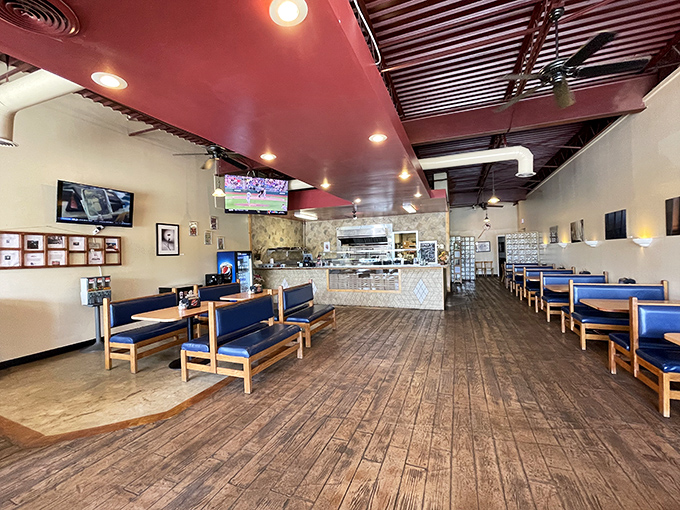 Wooden floors and minimalist decor let the star of the show&mdash;those caramelized cheese edges&mdash;take center stage.