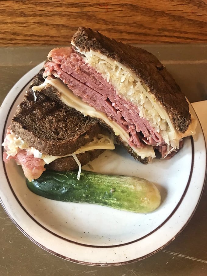 Behold, the king of sandwiches! This Reuben is stacked higher than Boston's skyline and twice as impressive.