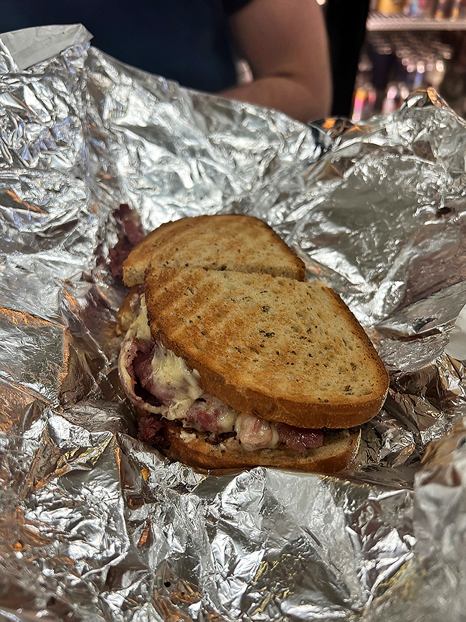 Behold, the Reuben in all its glory! This sandwich isn't just lunch; it's a religious experience between two slices of rye.