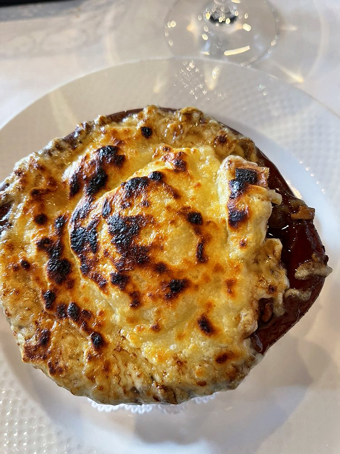 Behold, the crown jewel of comfort food! This French onion soup looks so good, it might make you consider trading your car for a bicycle.