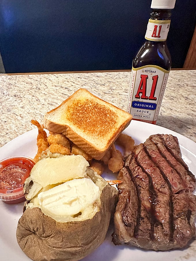 "Steak so good, it'll make you forget your table manners." This plate is a carnivore's dream come true, featuring a perfectly grilled steak alongside classic sides that'll transport you to comfort food heaven.