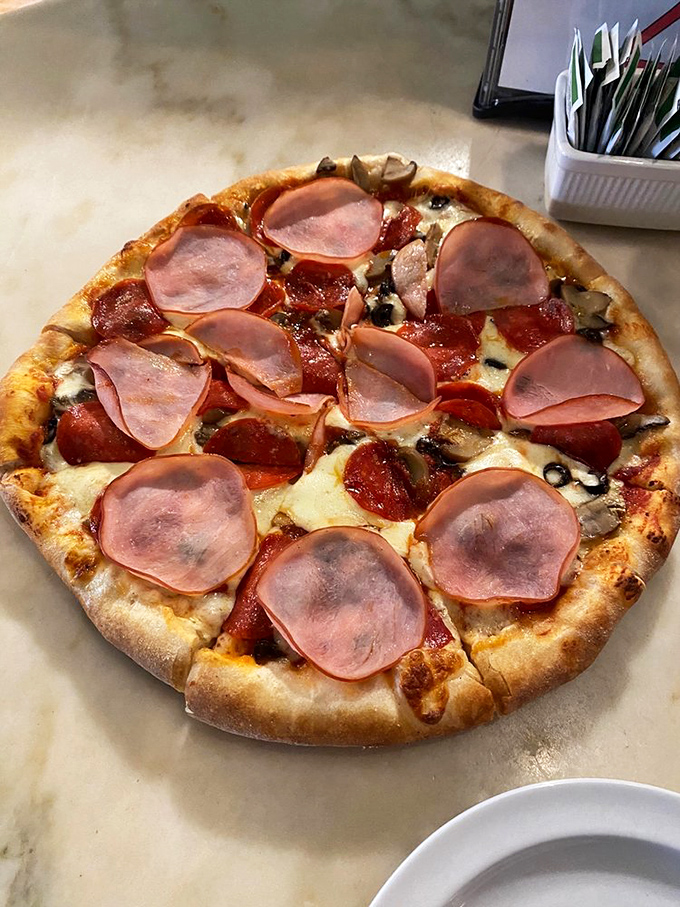 The "Big Ed's Special" - where ham and sausage join forces with veggies to create a pizza superhero team.