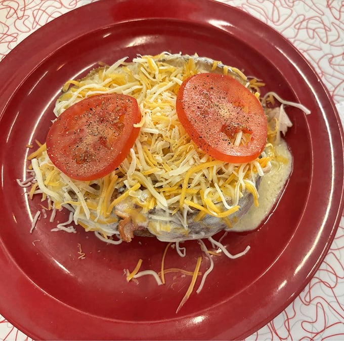Cheese, please! This loaded spud is living its best life, proving that sometimes, the most beautiful things in life are the messiest.