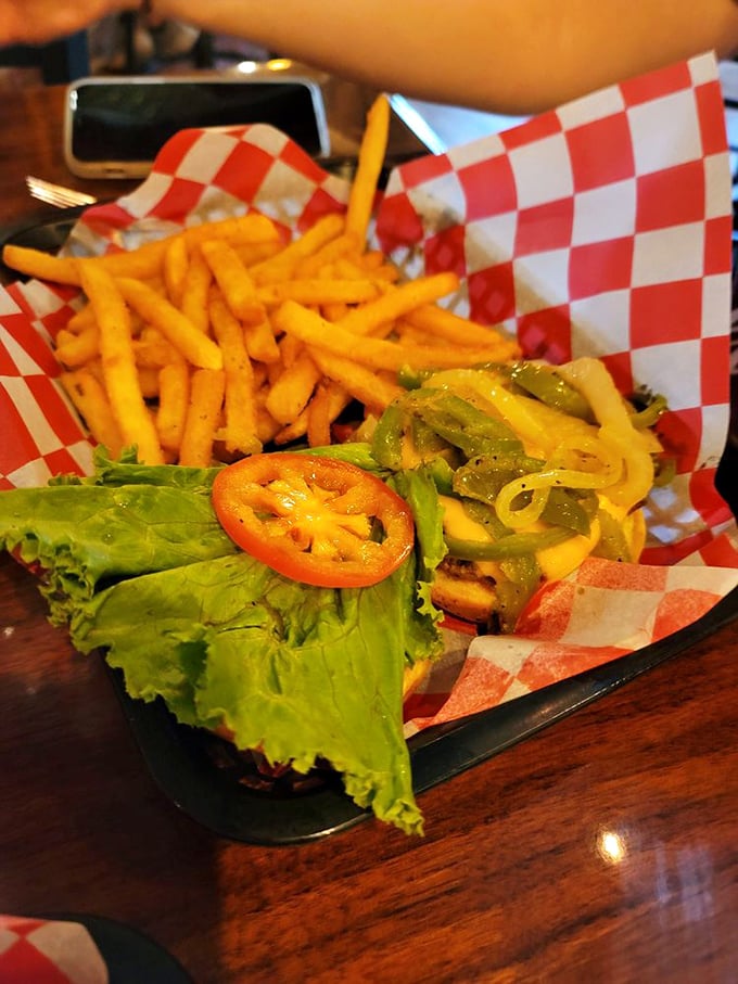 Burger bliss awaits! This juicy masterpiece comes with a side of golden fries and a generous helping of pure satisfaction.
