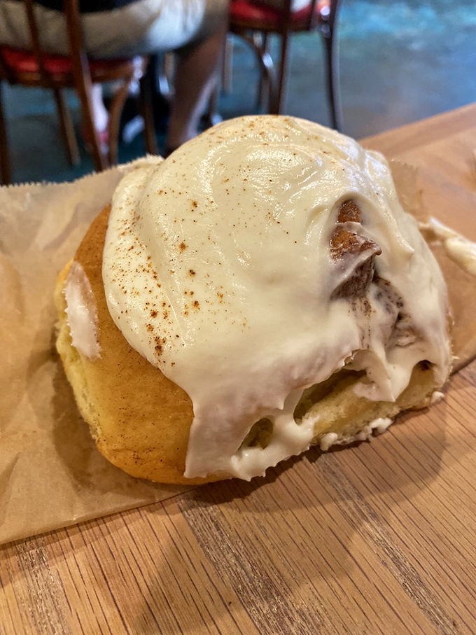 Holy frosting, Batman! This cinnamon roll isn't just breaking the rules, it's rewriting the pastry playbook. Napkins: strongly advised.