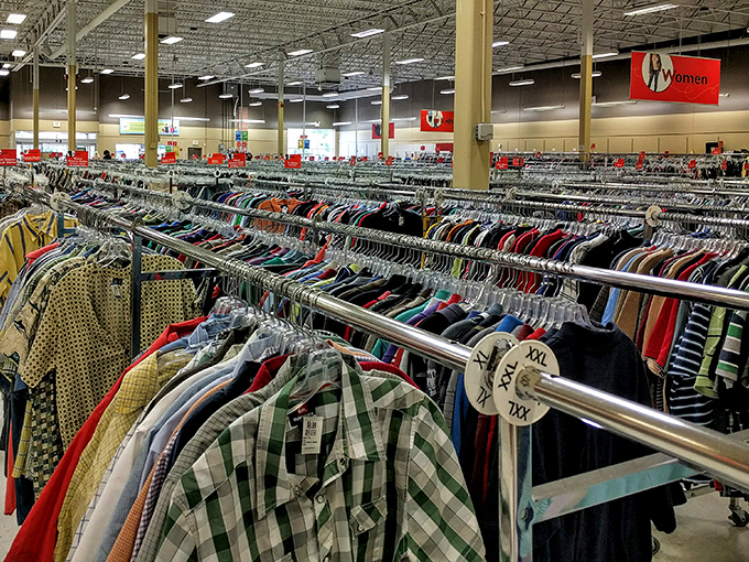 A sea of sartorial stories hangs before you. Each garment whispers tales of past lives, waiting for its next chapter.