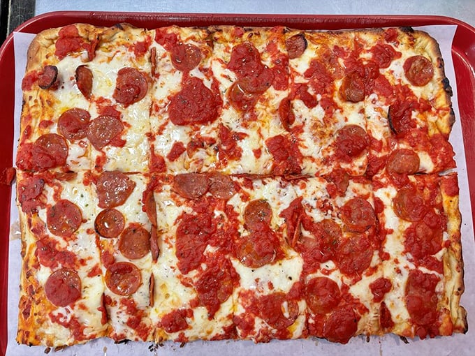 Cheese and pepperoni, the dynamic duo of pizza toppings! This square sensation is so good, it'll make you question why circles ever became the pizza norm.