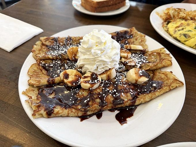 Chocolate dreams and banana bliss! This crepe creation is like a warm hug for your taste buds, proving that dessert for breakfast is always a good idea.