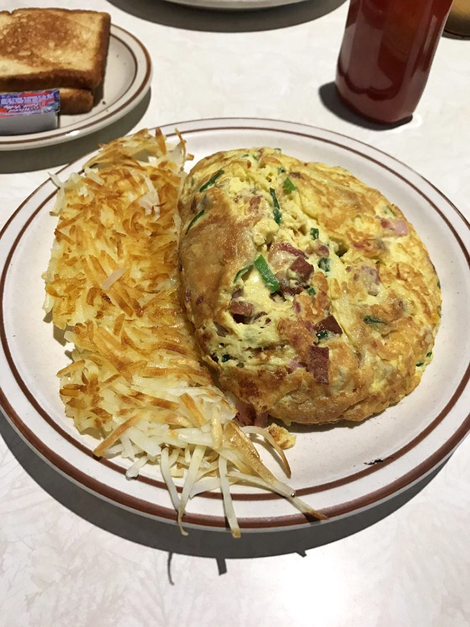Fluffy, golden, and packed with flavor &ndash; this omelet is the breakfast equivalent of a warm Hawaiian sunset. Who needs a postcard when you can have this?