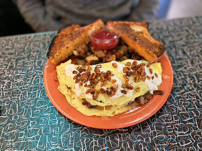 Eggs-cellent choice! This fluffy omelet is dressed to impress, with a side of crispy toast for good measure.