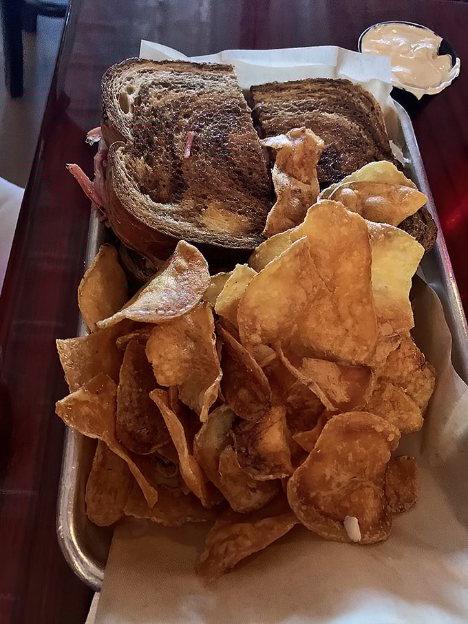 The Reuben and chips: a dynamic duo that puts Batman and Robin to shame. Gotham City's got nothing on this plate of perfection.