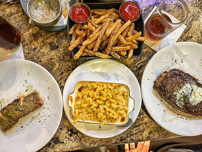 Surf meets turf in this glory shot of perfection. The mac and cheese steals the spotlight while salmon and steak wait patiently in the wings.