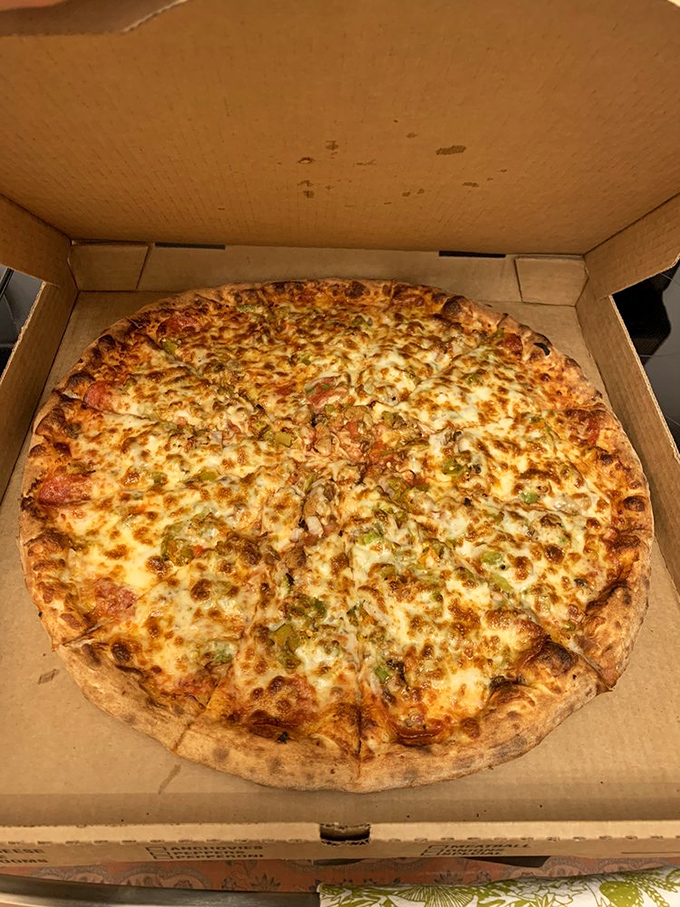 Holy mozzarella, Batman! This supreme pizza is loaded with more toppings than a superhero has gadgets.