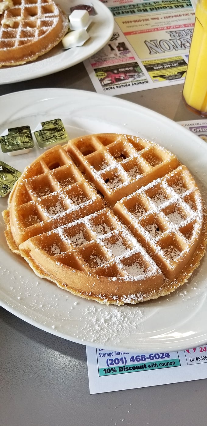 Golden, crispy, and ready for its close-up. This waffle isn't just breakfast; it's edible architecture waiting to be drizzled with syrup.