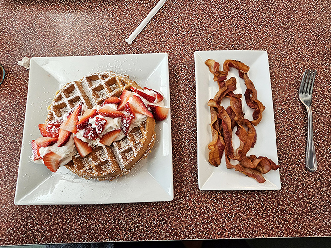 The dynamic duo of breakfast: golden waffles and crispy bacon. It's the Batman and Robin of morning meals, here to save your day.
