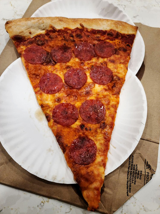Behold, the pepperoni slice that ate Manhattan! This bad boy's so big, it needs its own area code.