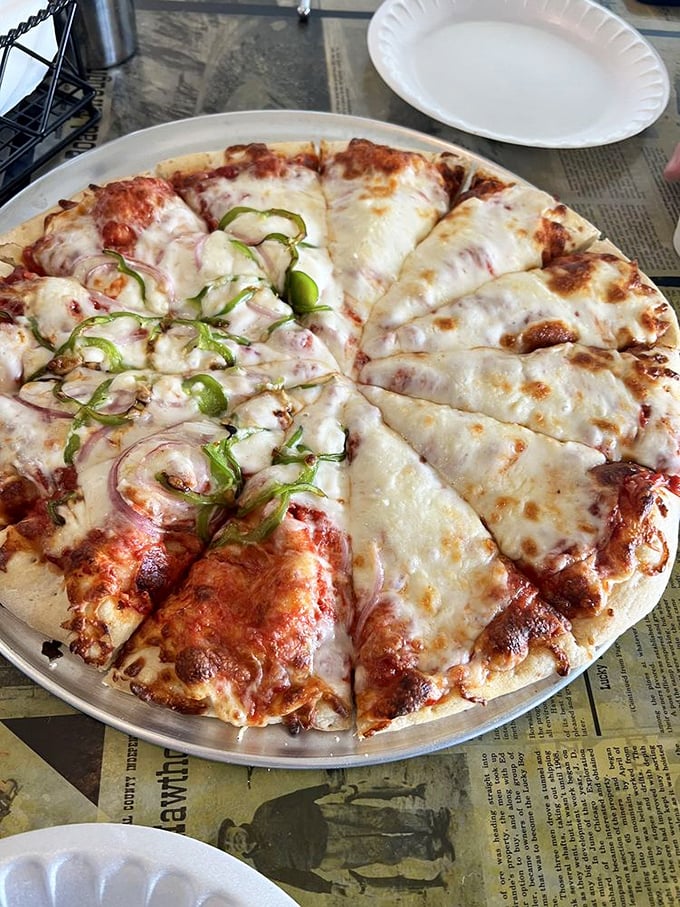 Cheese, please! This pizza's stretchy strings could double as a trapeze act in a very delicious circus.