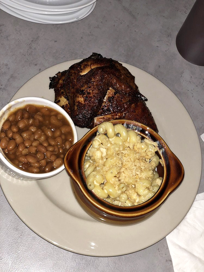 This plate tells the whole story &ndash; smoky chicken with a perfect bark, baked beans that didn't come from any can, and mac and cheese that deserves its own fan club.