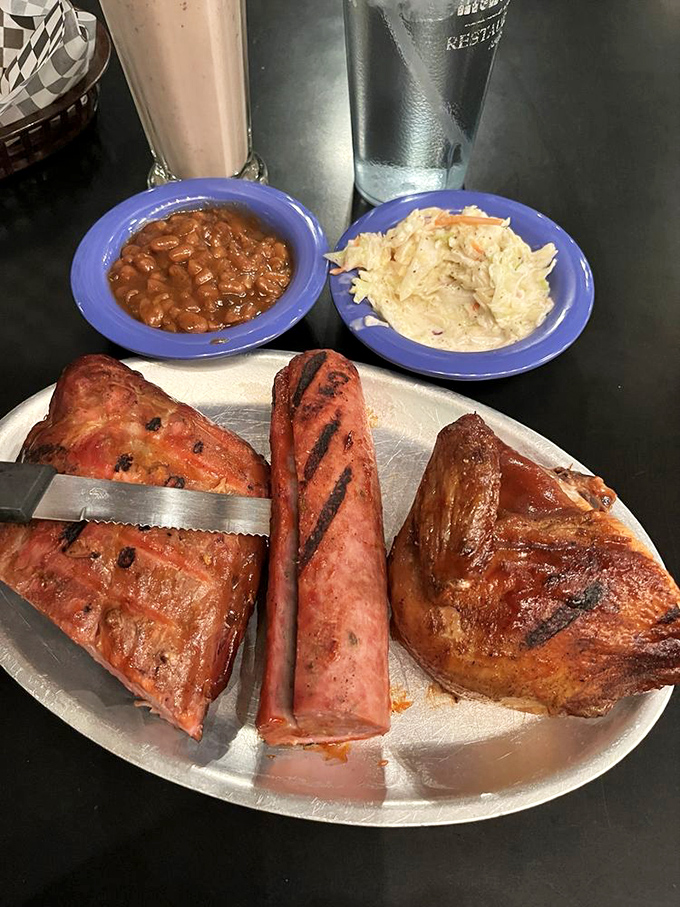 The holy trinity of barbecue! This meat sampler is the carnivore's dream team, ready to score a touchdown in your mouth.