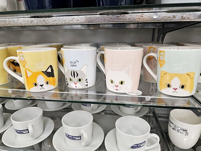 Cat mugs that judge you less than actual cats. The perfect vessels for morning coffee that costs more than the mug itself.