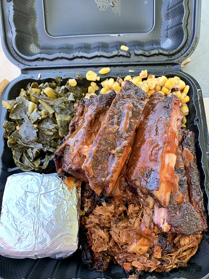 Holy smoke rings, Batman! This platter is a carnivore's dream come true, featuring fall-off-the-bone ribs and sides that'll make your taste buds dance.