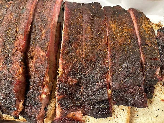 Holy smoke rings, Batman! These dry-rubbed ribs look like they've been touched by the barbecue gods themselves. Resistance is futile.