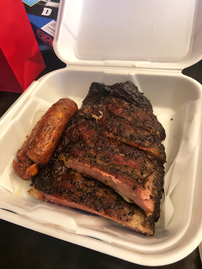 Holy smokes, Batman! These ribs and sausages look so good, they might just make vegetarians question their life choices.