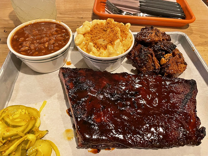 Holy smokes, Batman! These baby back ribs look so good, they might just make you forget about Robin. Paired with mac and cheese that's creamier than a smooth-talking salesman.