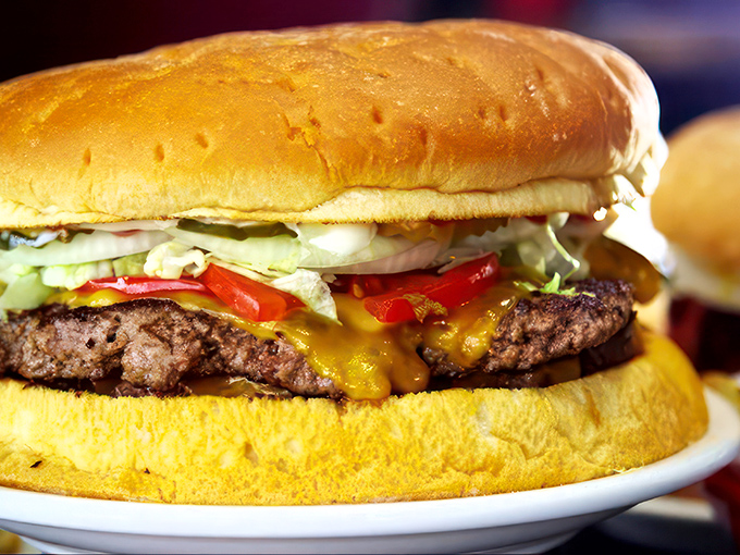 Holy cow! The Big Jud's Special is a skyscraper of beef that'll have you wondering, "Is this a burger or an edible Jenga tower?"