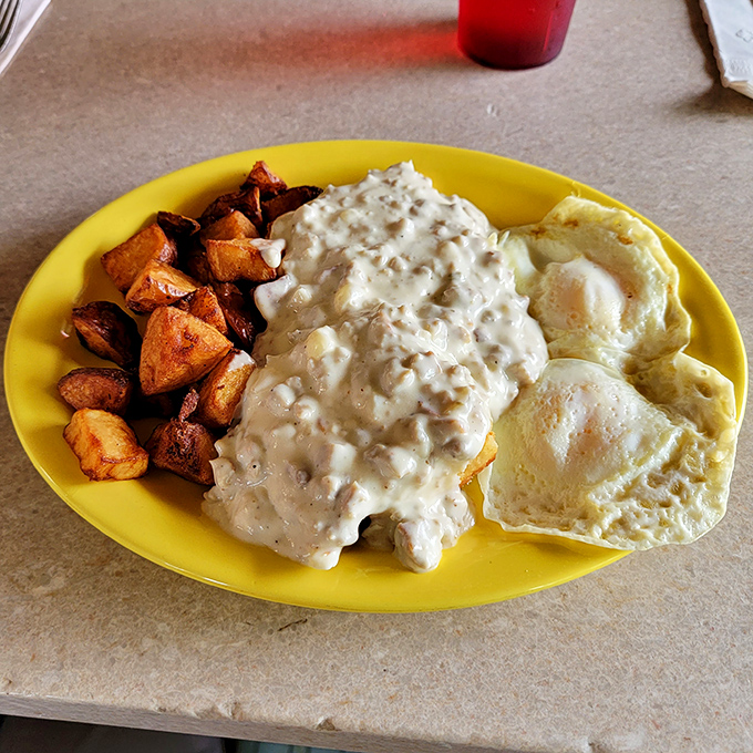 Biscuits and gravy: Where cloud-like carbs meet a river of savory goodness. Fork and knife required, but a bib is optional.