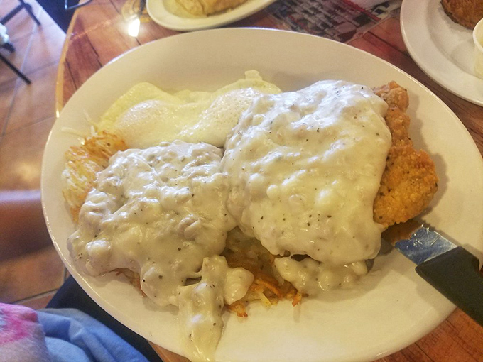 Holy gravy, Batman! This plate of biscuits and gravy isn't just a meal, it's a warm, peppery hug for your soul. Comfort food level: expert.
