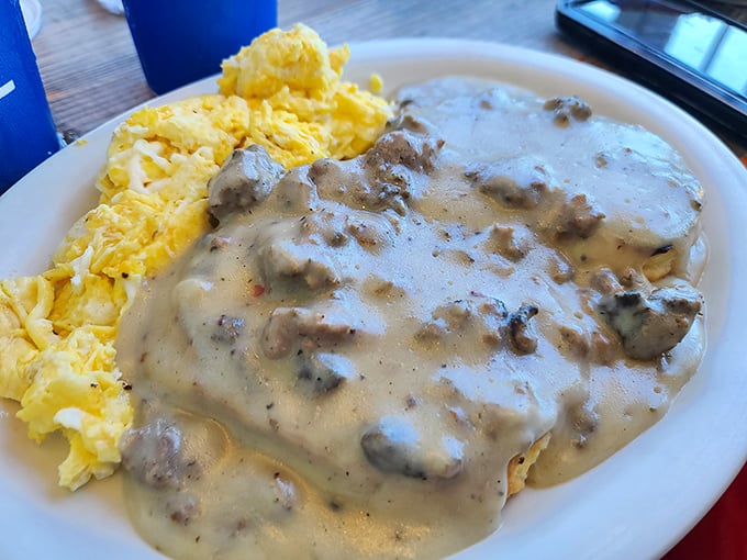 Biscuits and gravy with a side of sunshine. This plate's so comforting, it could probably solve world peace if we let it.