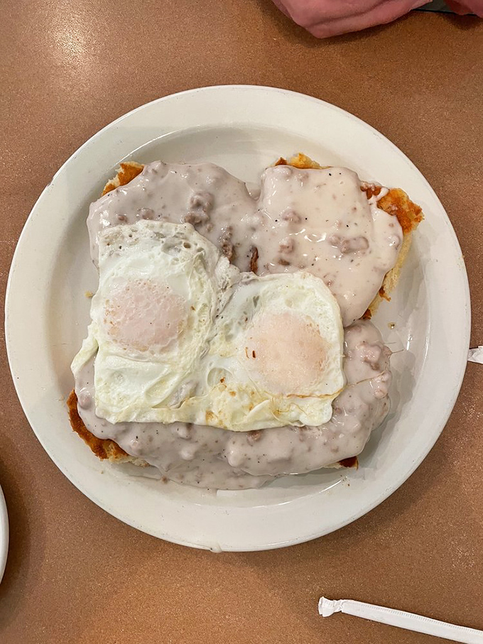 Biscuits and gravy with sunny-side-up eggs&mdash;the breakfast equivalent of a warm hug from your favorite grandparent. Comfort food perfection on a plate.