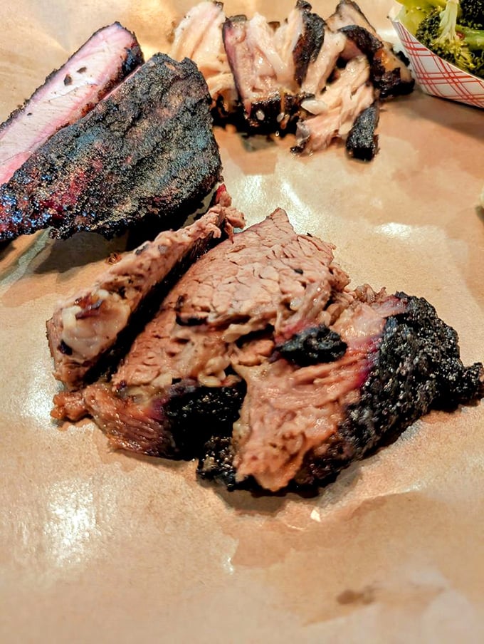 Brisket with a bark so perfect it should be in a museum. The pink smoke ring is nature's way of saying "you're welcome."