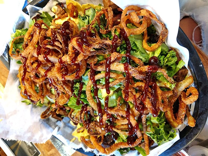 Holy guacamole, Batman! These nachos are piled higher than your to-do list. A crispy, cheesy mountain that's worth every calorie-climbing bite.