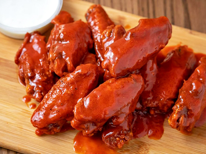 These buffalo wings aren't just coated in sauce&mdash;they're having a full-on sauce spa day. The kind of wings that make napkins nervous.